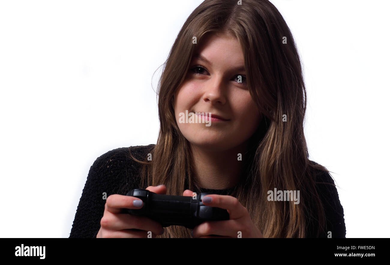 Young woman playing video games and having fun Stock Photo - Alamy