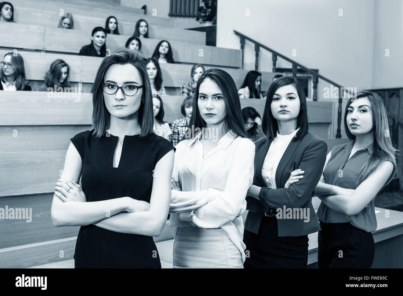 Young women in classroom with students Stock Photo - Alamy