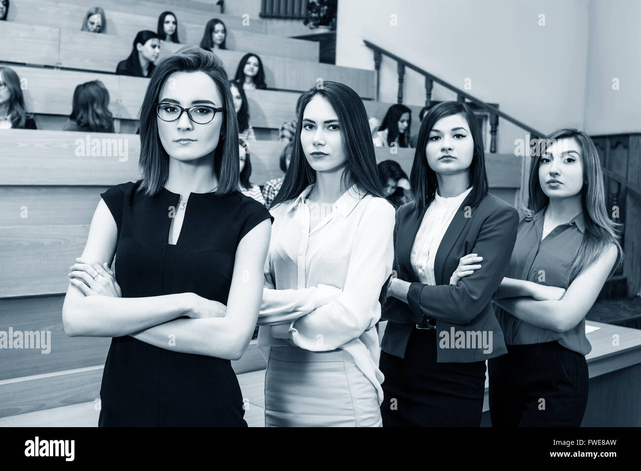 Young women in classroom with students Stock Photo - Alamy