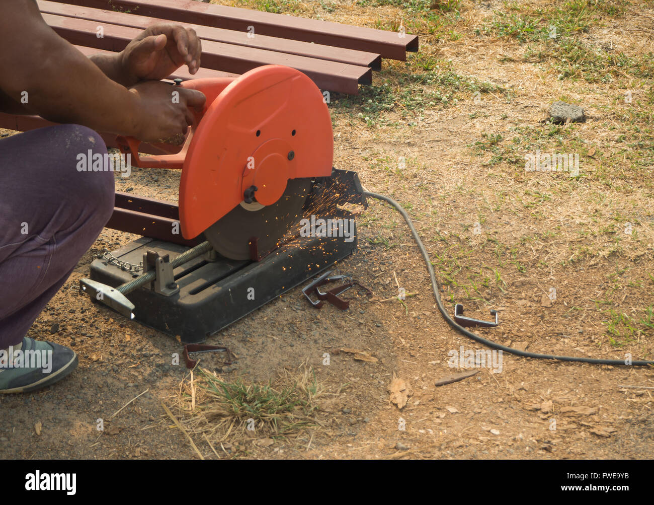 Worker use steel cutter machine cut steel, Spark Stock Photo - Alamy