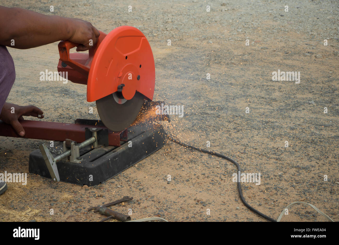 Worker use steel cutter machine cut steel, Spark Stock Photo - Alamy