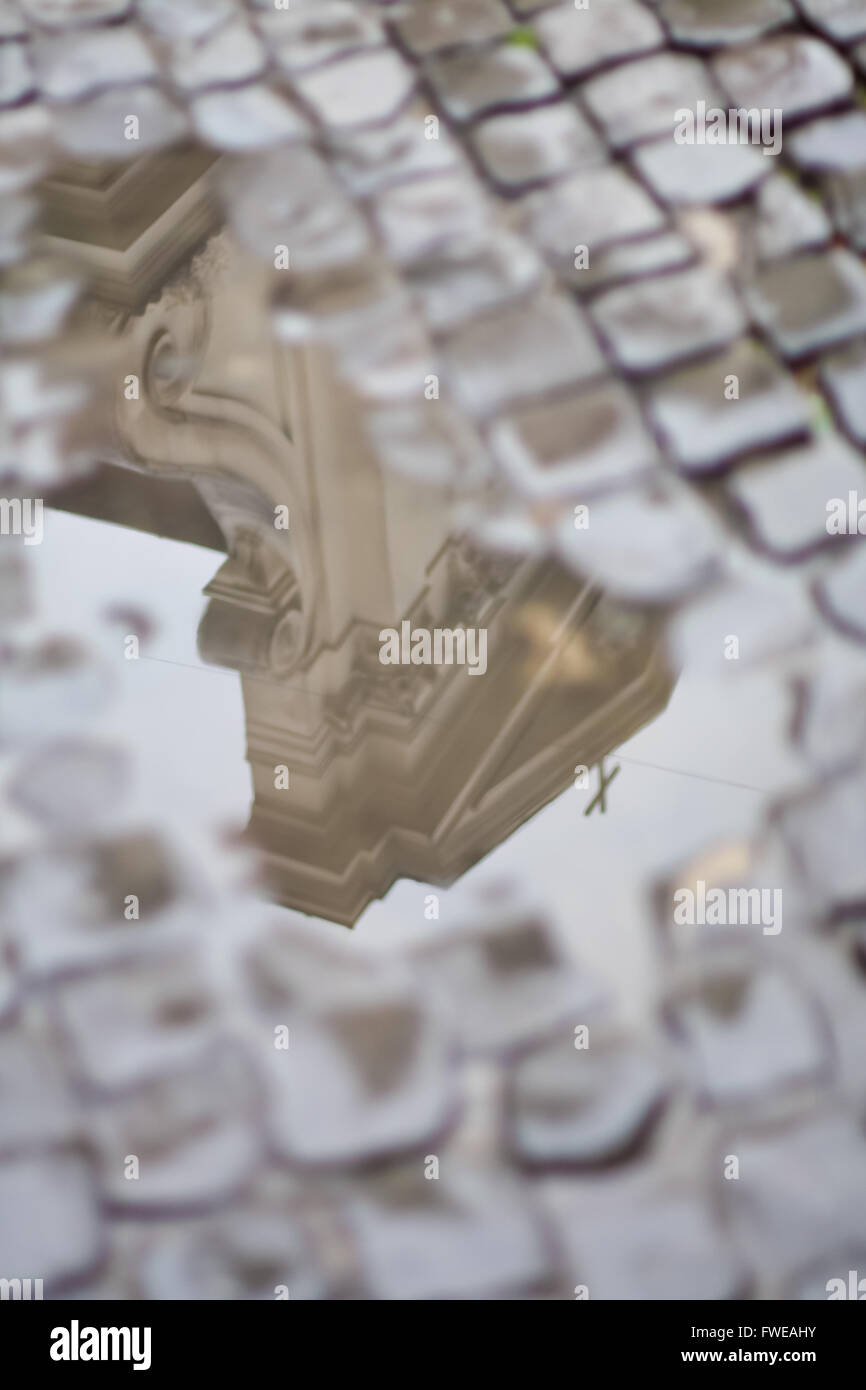 Trastevere District's Church in blurry puddle reflection Stock Photo ...
