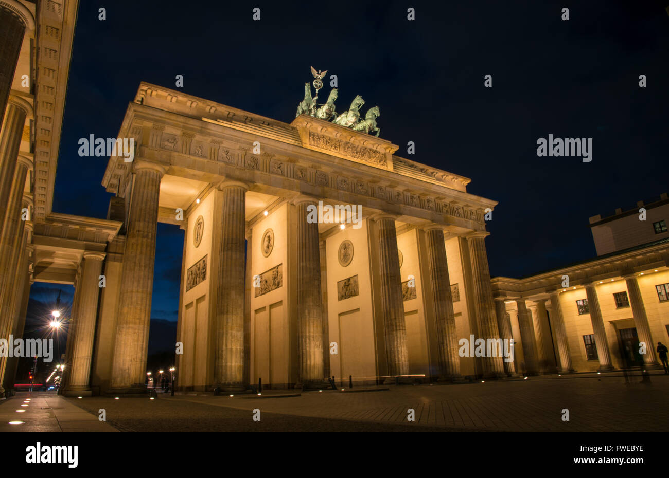 lluminated famous neoclassical triumphal arch of Brandenburg Gate one ...