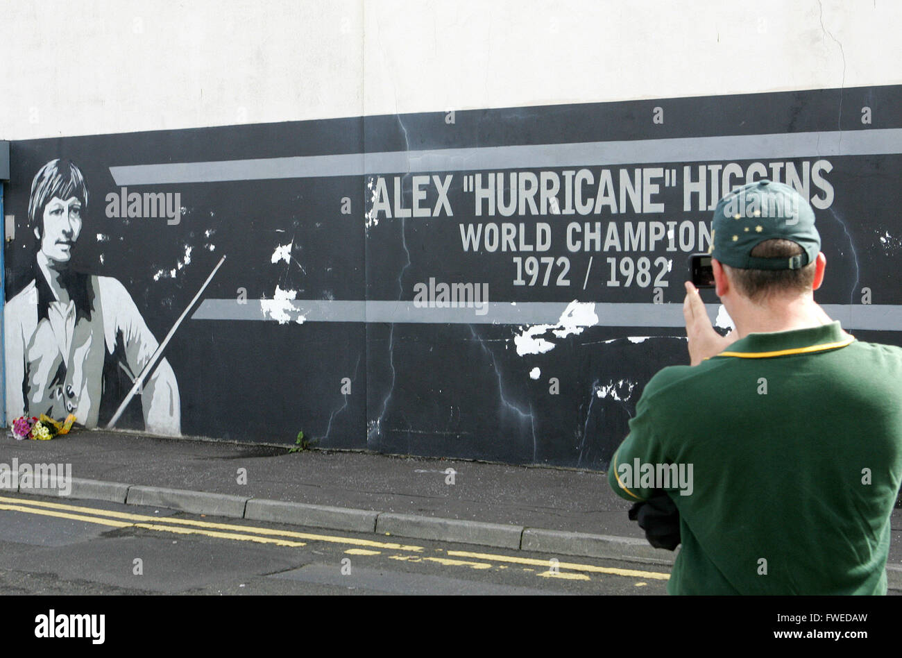 Irish Snooker star Higgins dies. A tourist photographs a mural of ...