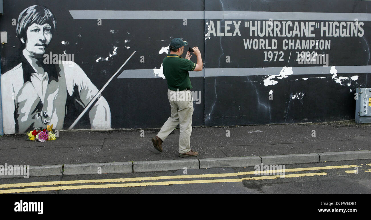 Irish Snooker star Higgins dies. A tourist photographs a mural of ...
