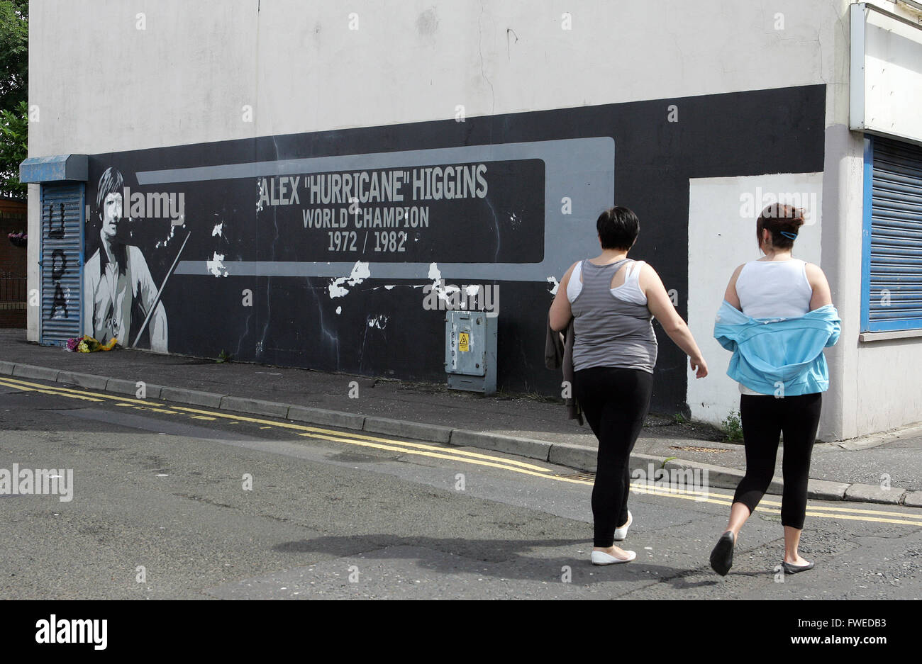Irish Snooker star Higgins dies. A tourist photographs a mural of ...