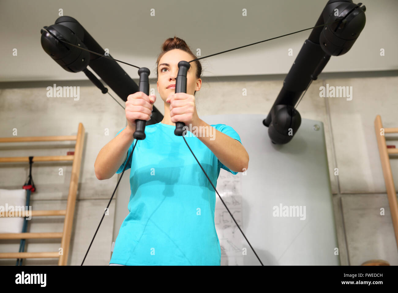 Workout at the gym. Rehabilitation, training with rubbers. Gym ...