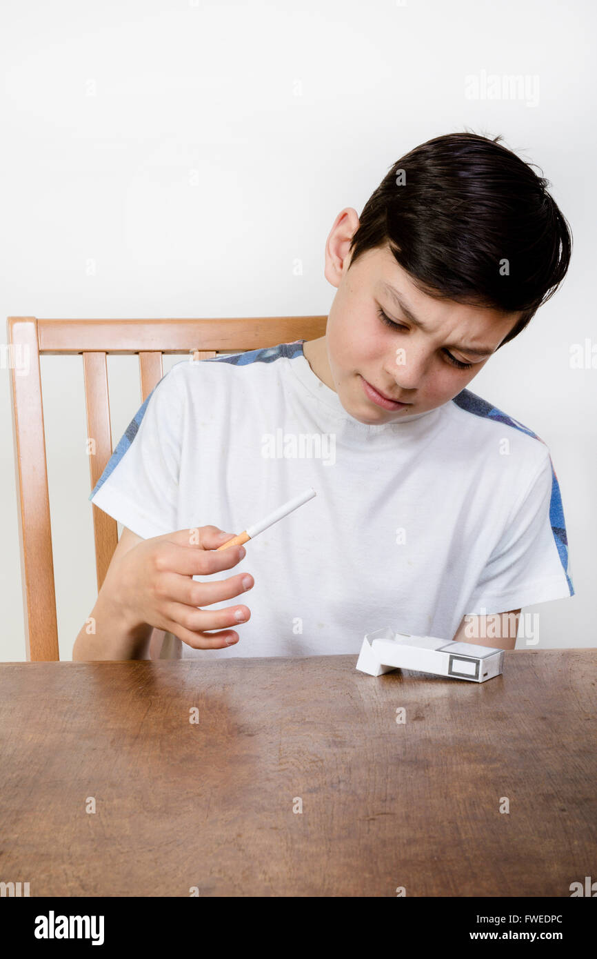 Teen boy smokes cigarette hi-res stock photography and images - Alamy