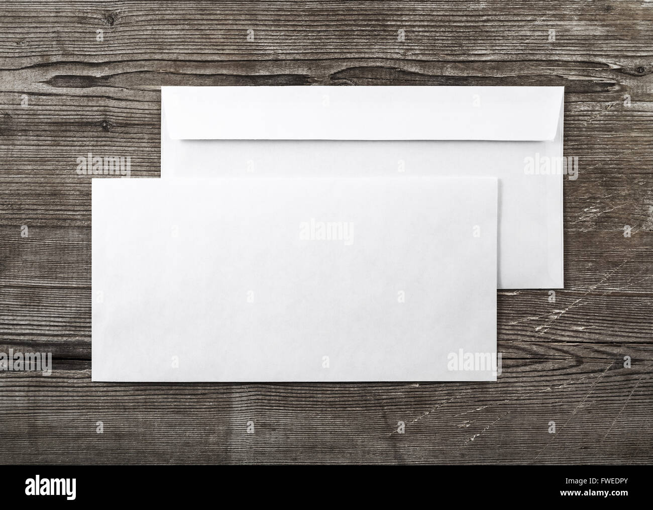 Blank envelopes on wooden background. Back and front view. Template for ...