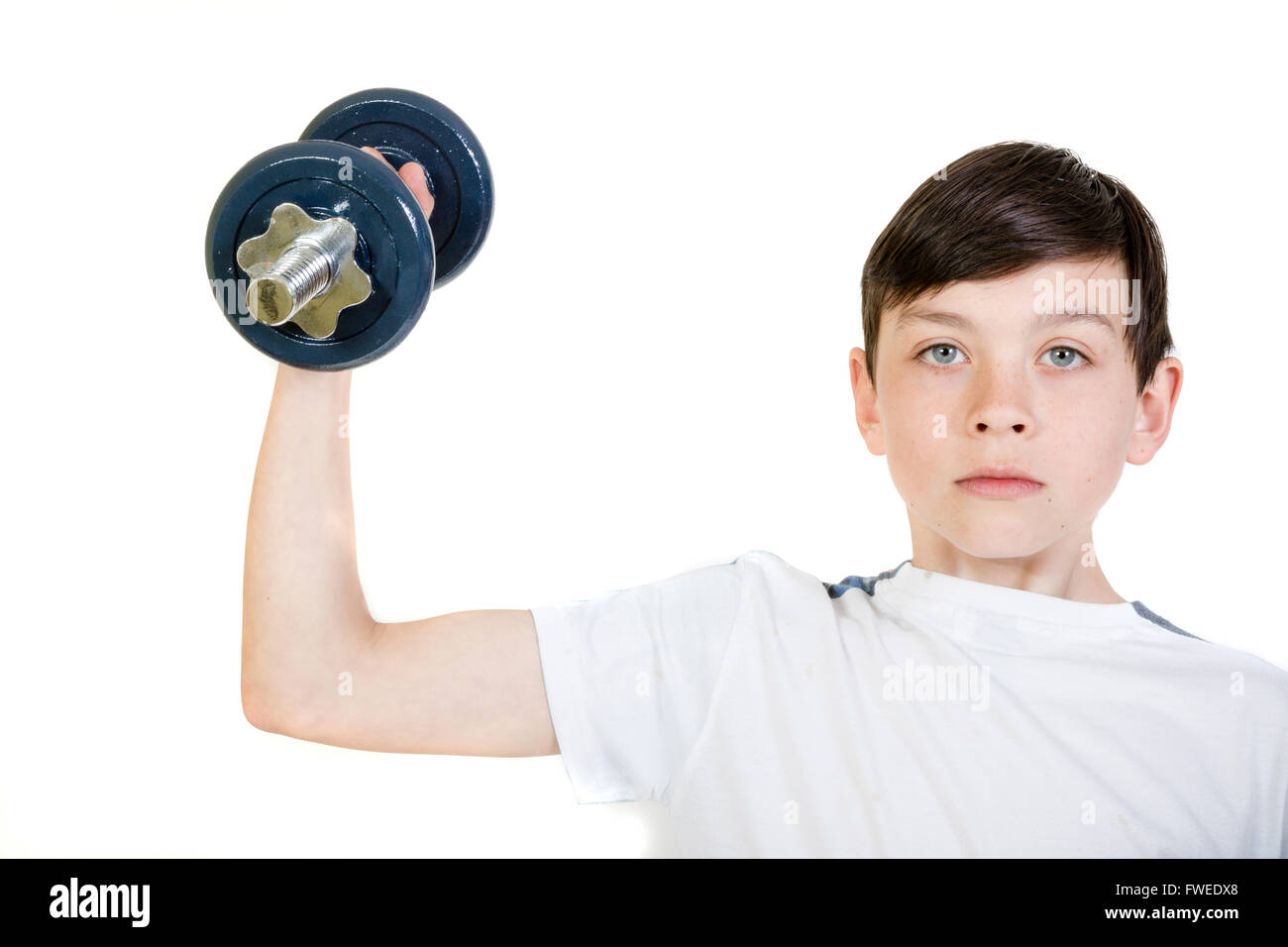 Young boy lifting a dumbbell Stock Photo - Alamy