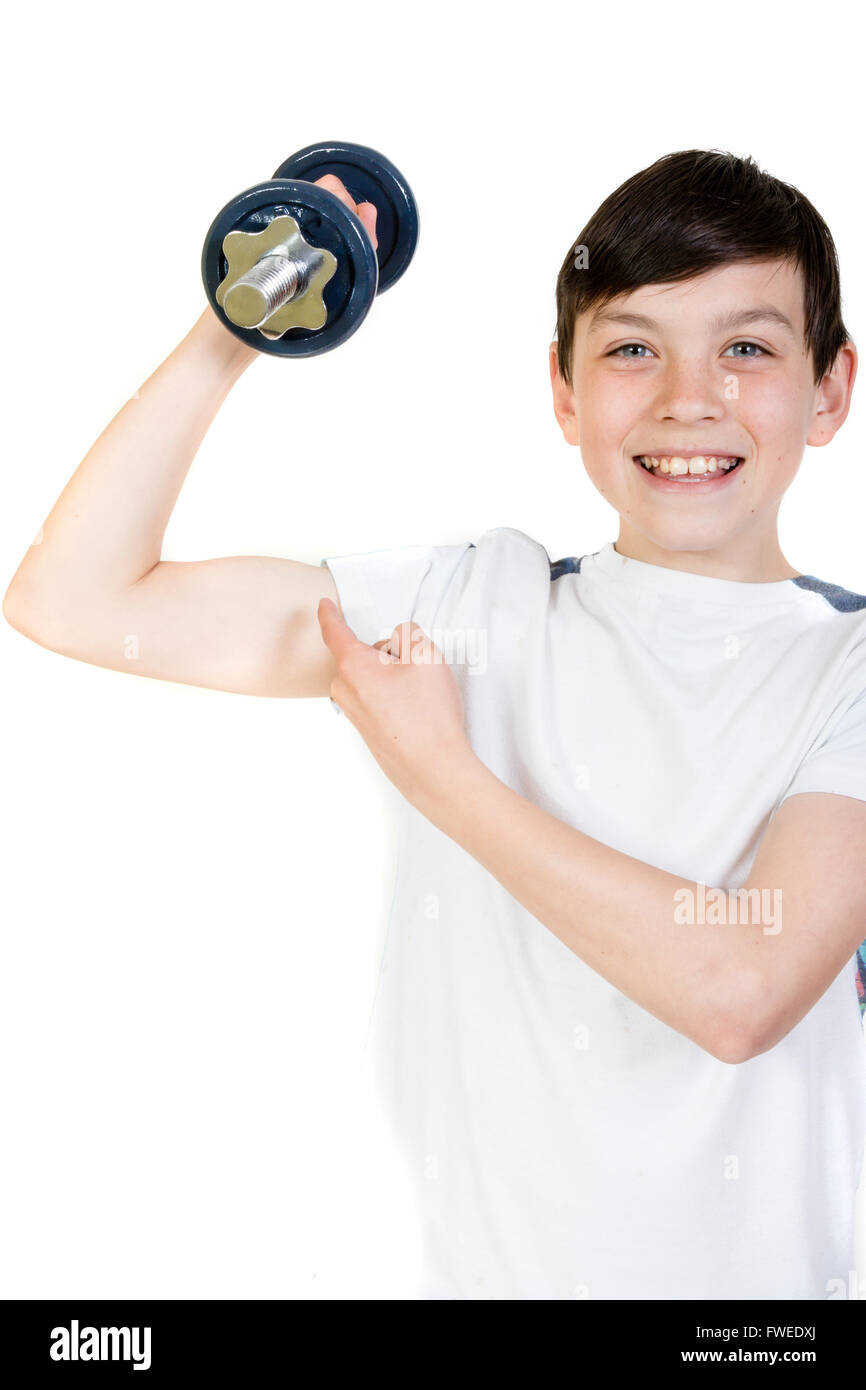 Happy boy lifting a dumbbell pointing at his bicep Stock Photo - Alamy