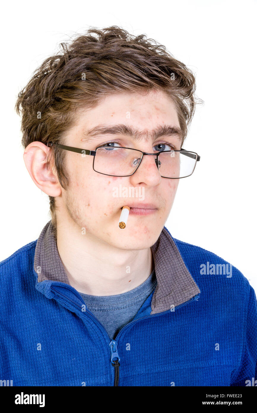 Teen boy smoking cigarette hi-res stock photography and images - Alamy