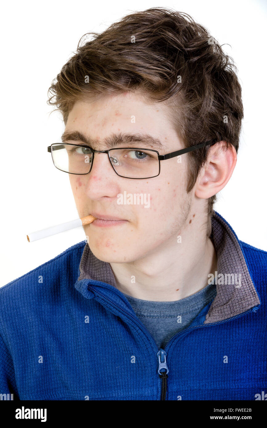 Teen boy smoking cigarette hi-res stock photography and images - Alamy