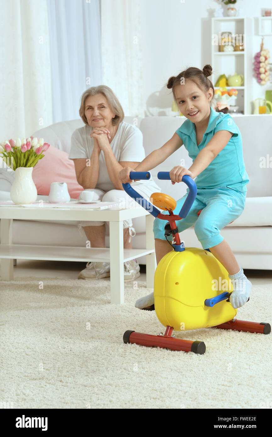 little granddaughter doing exercise Stock Photo - Alamy