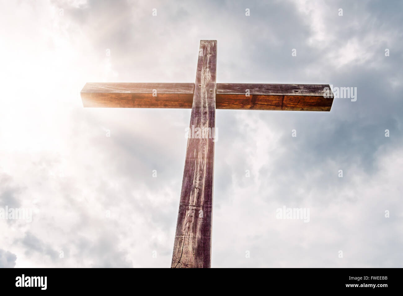 Simple wooden cross against the sky, bathed in sunlight Stock Photo - Alamy