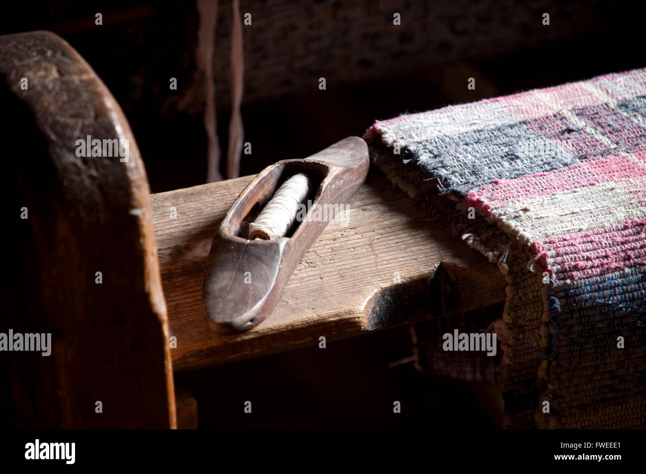 Historical wooden thread shuttle with handmade textile Stock Photo - Alamy
