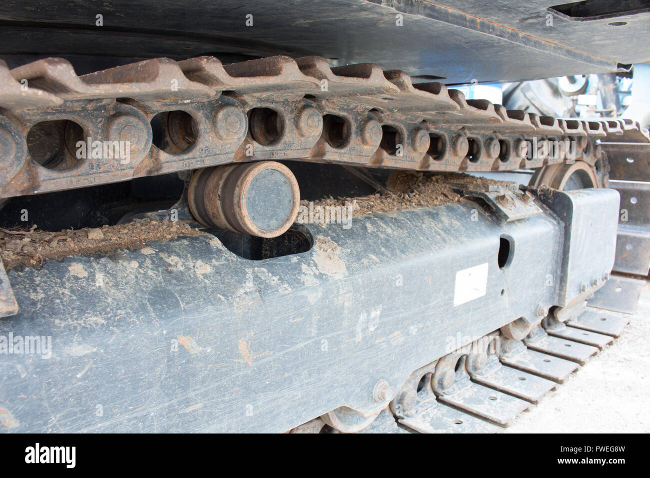 return rollers of crawler excavators small ground Stock Photo - Alamy