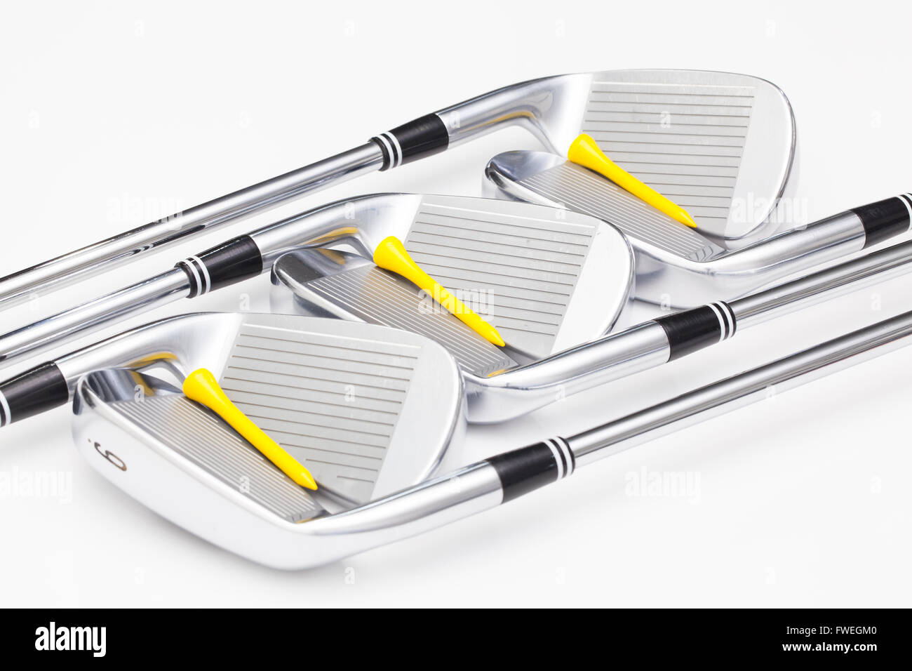 Titanium golf clubs on the white background Stock Photo - Alamy