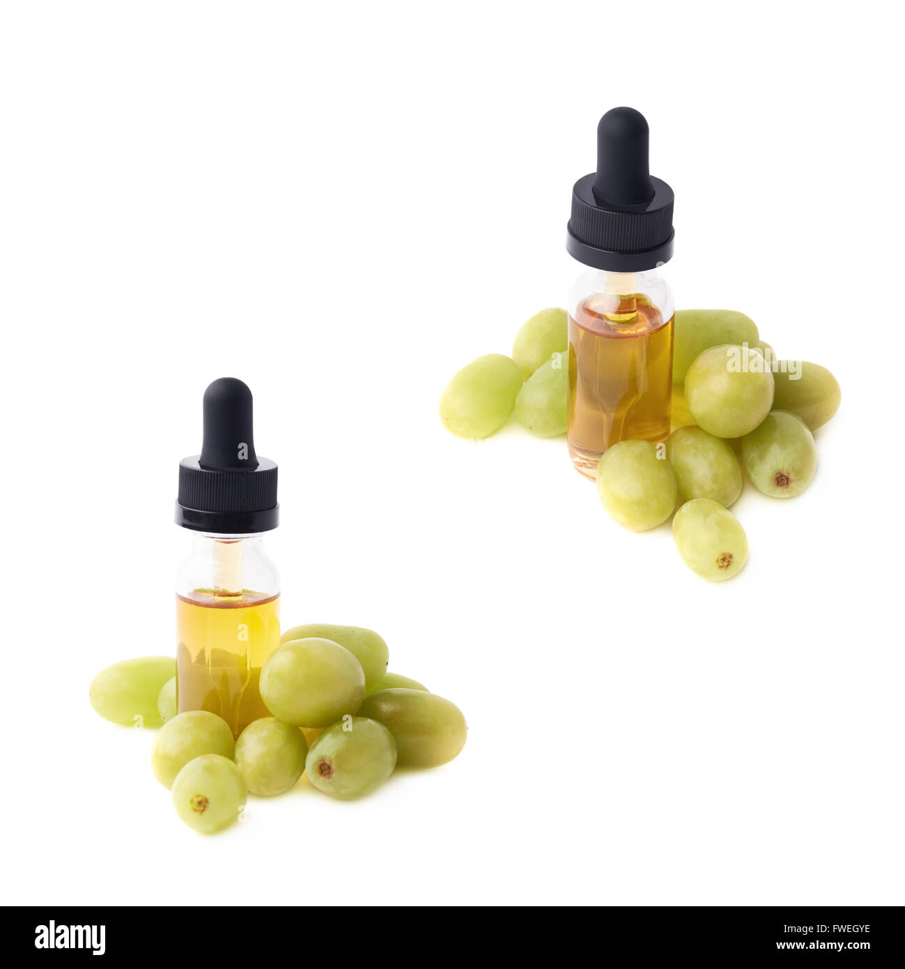Grape seed oil essence composition isolated Stock Photo - Alamy