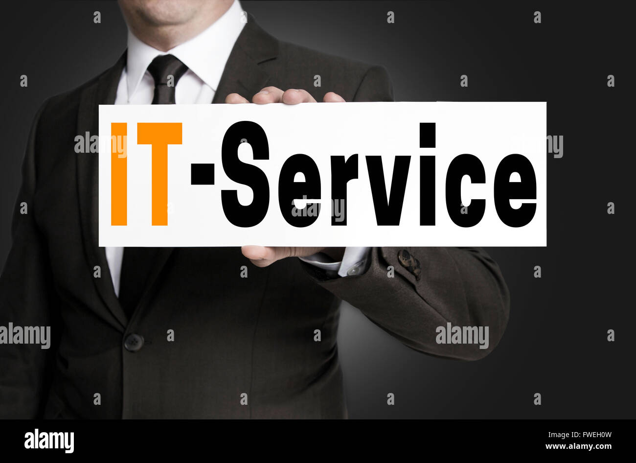 it service sign is held by businessman background Stock Photo - Alamy
