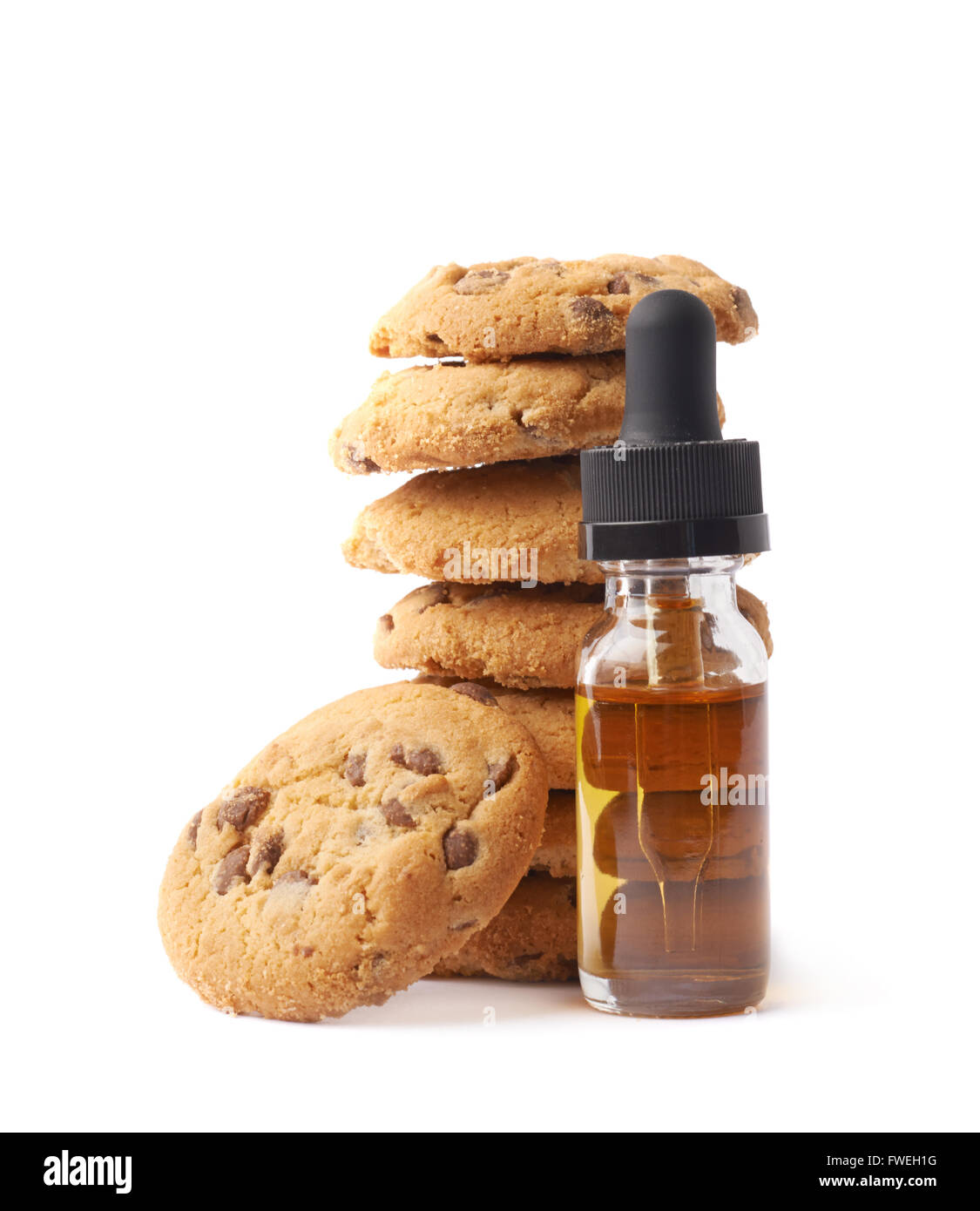 Oil essence next to pile of cookies Stock Photo - Alamy