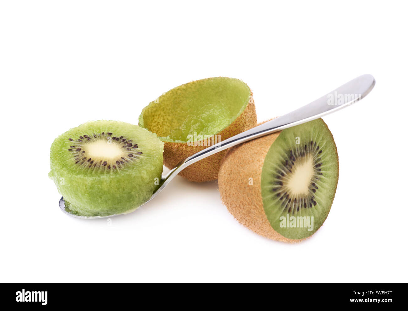 Eating kiwifruit with a teaspoon isolated Stock Photo - Alamy