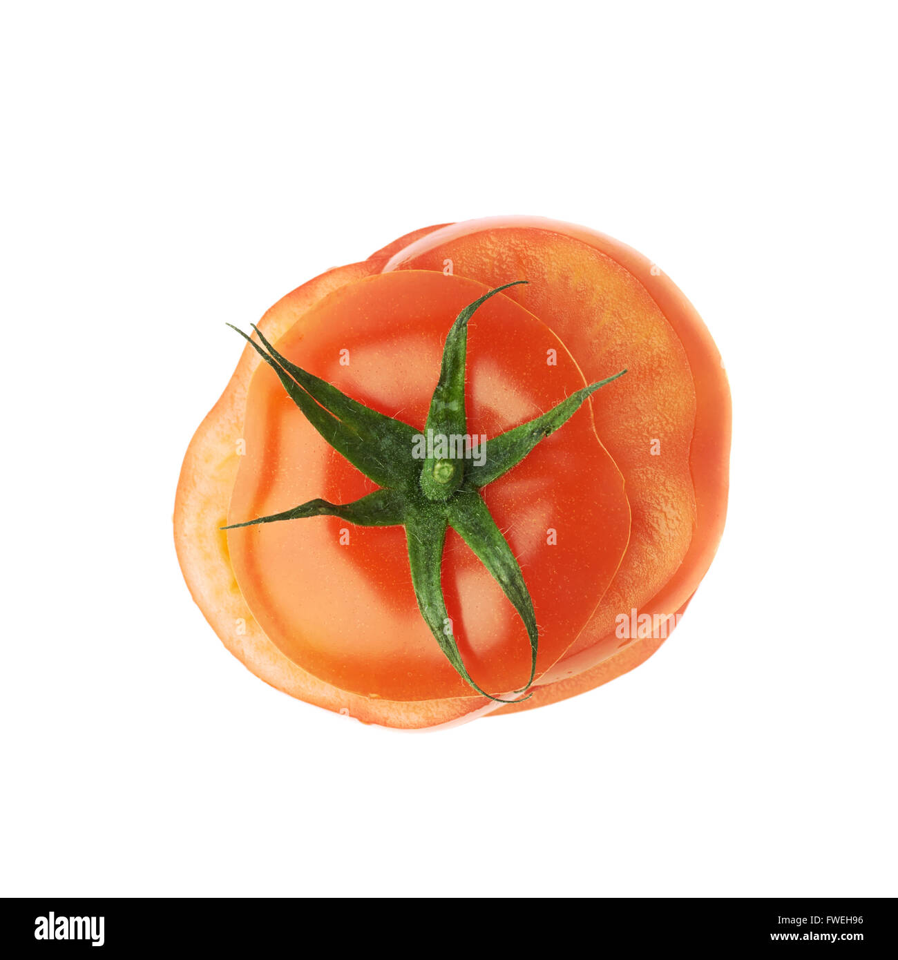 Tomato cut in slices isolated Stock Photo - Alamy