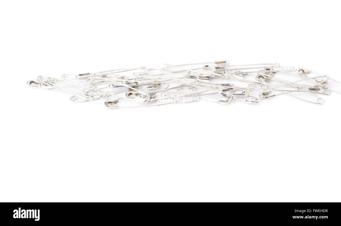 Pile of safety pins isolated on white background Stock Photo - Alamy