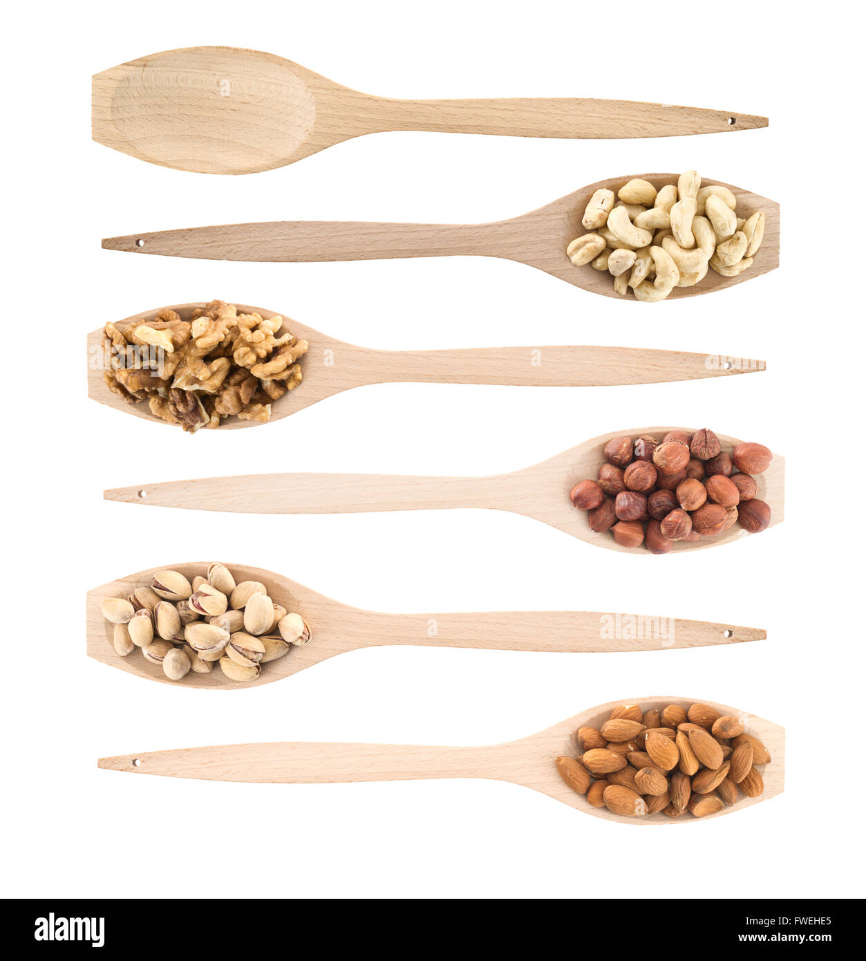 Wooden spoons full of different nuts Stock Photo - Alamy
