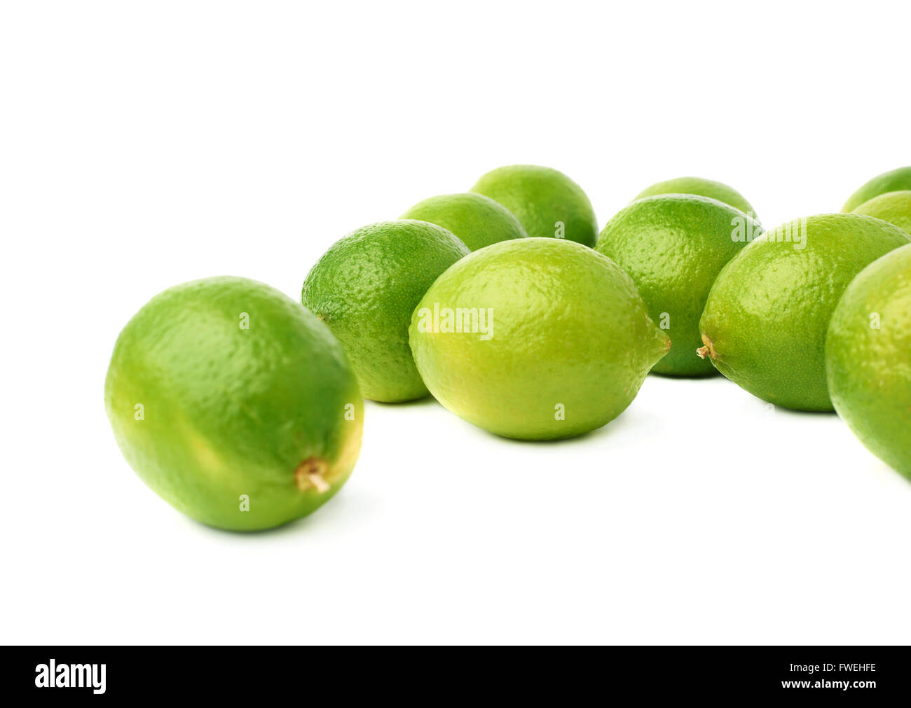 Surface covered with multiple ripe limes, composition isolated over the ...