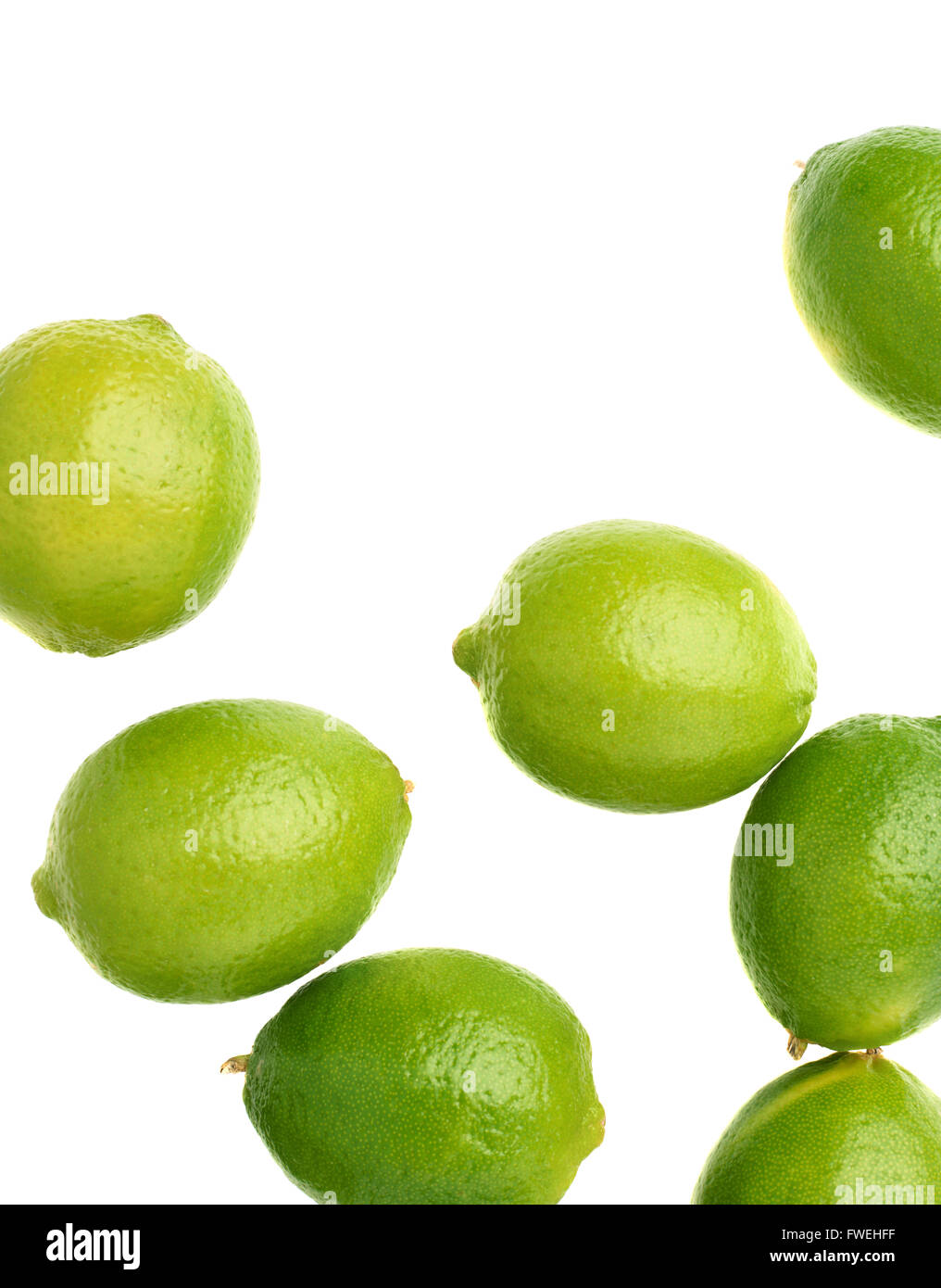Surface covered with multiple ripe limes, composition isolated over the ...