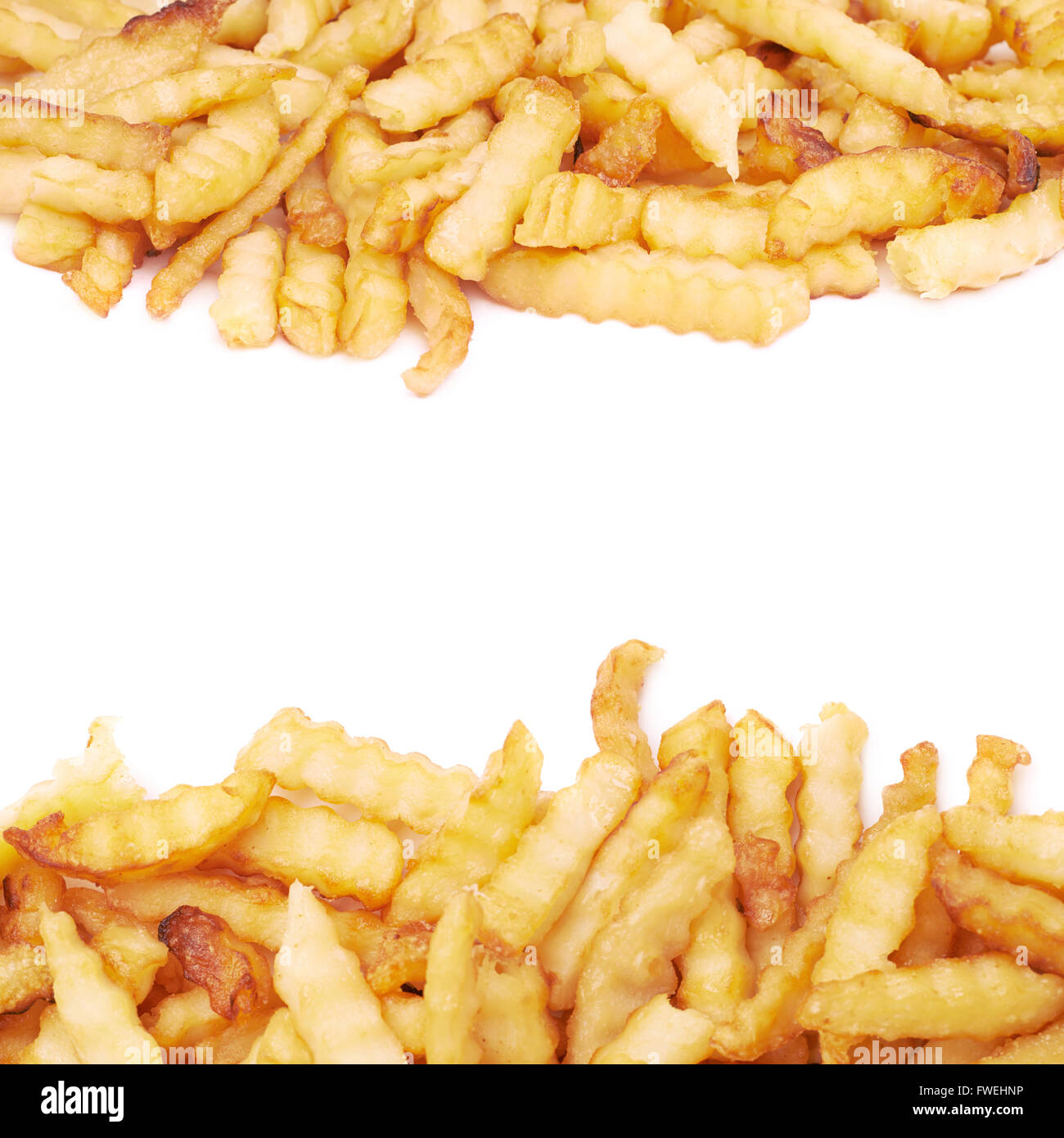 Pile of multiple wavy french fries isolated Stock Photo - Alamy
