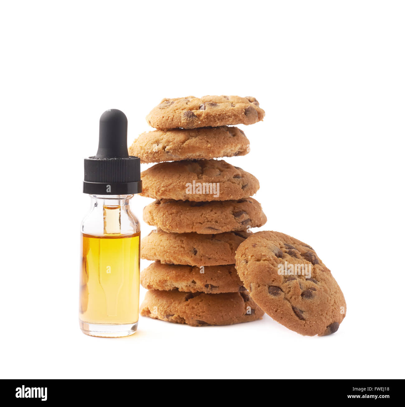 Oil essence next to pile of cookies Stock Photo - Alamy