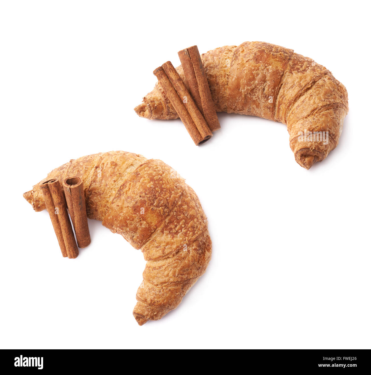 Croissant pastry and cinnamon sticks Stock Photo - Alamy