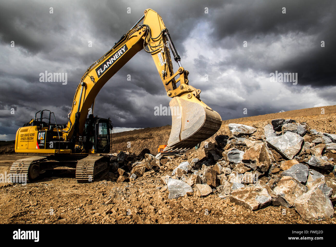 Large digger working in Quarry Stock Photo - Alamy