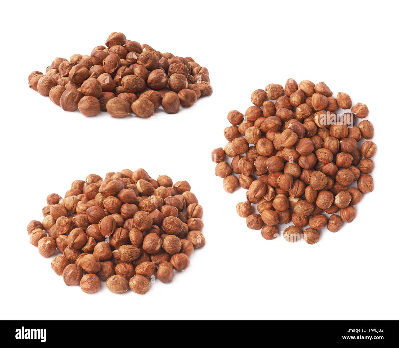 Pile of hazelnuts isolated Stock Photo - Alamy
