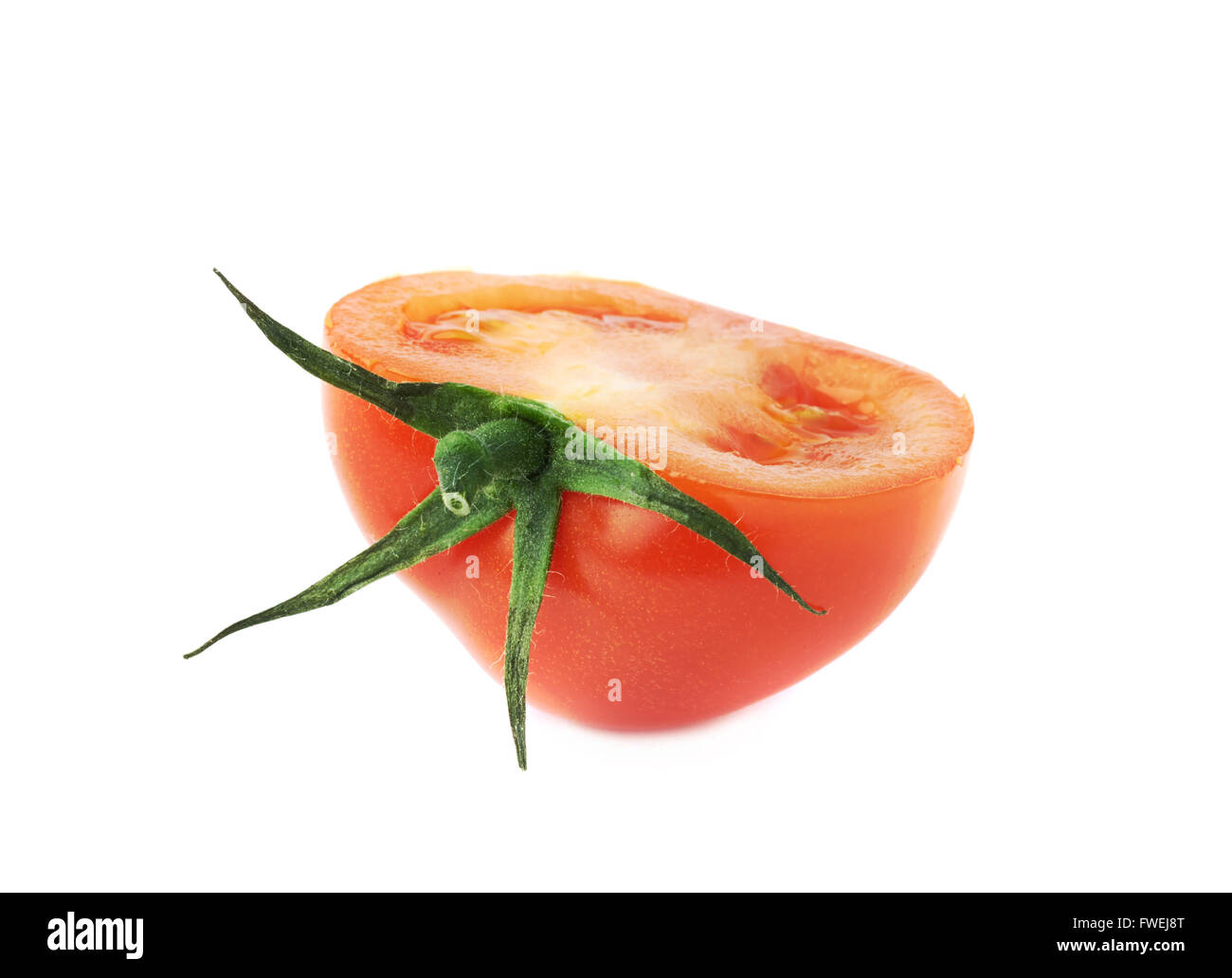 Tomato cut in half isolated Stock Photo - Alamy
