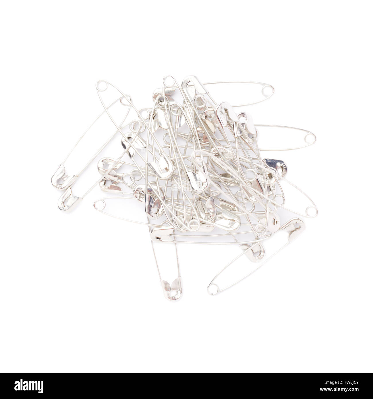 Pile of safety pins isolated on white background Stock Photo - Alamy