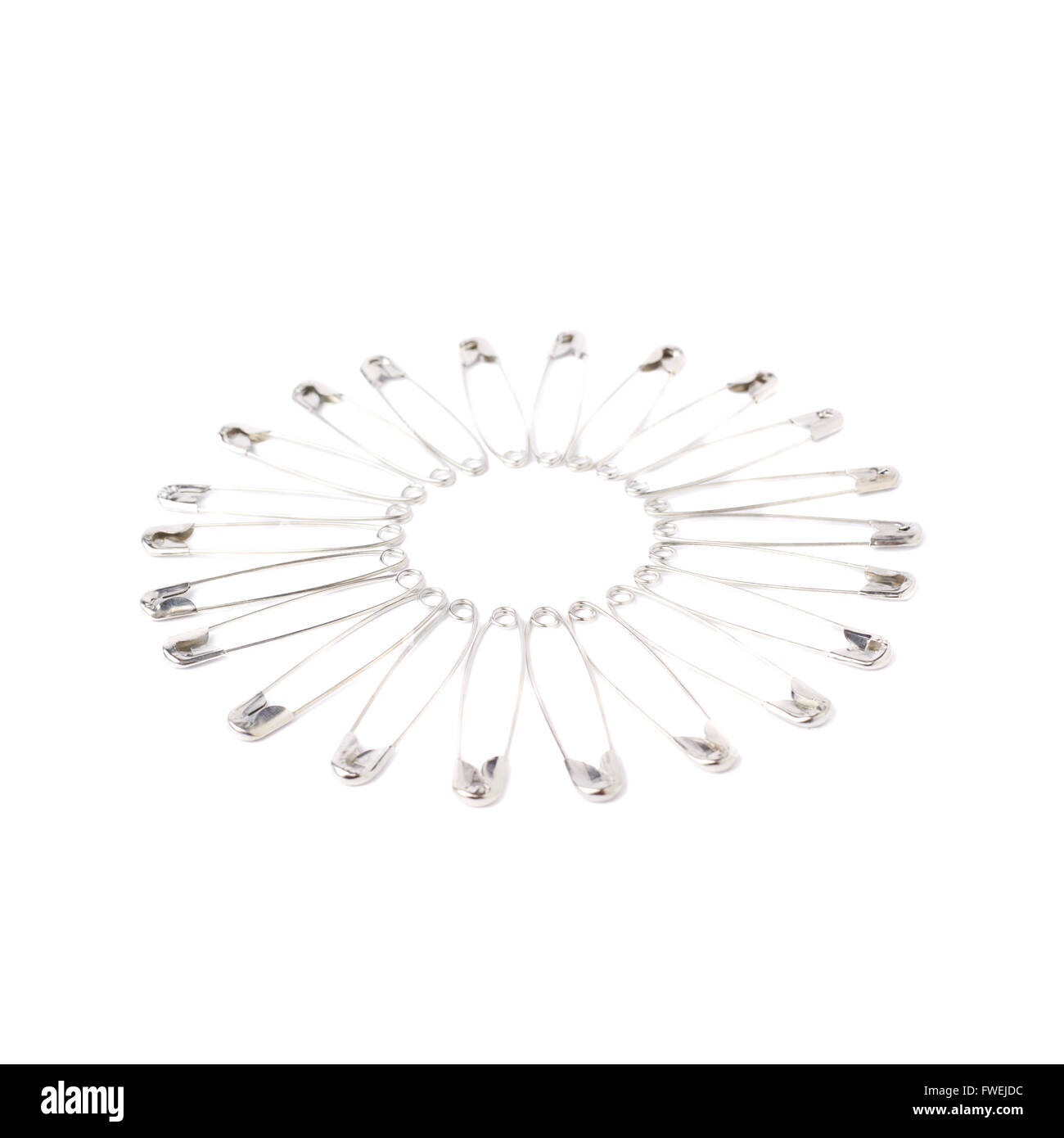 Round frame made of safety pins isolated on white background Stock ...