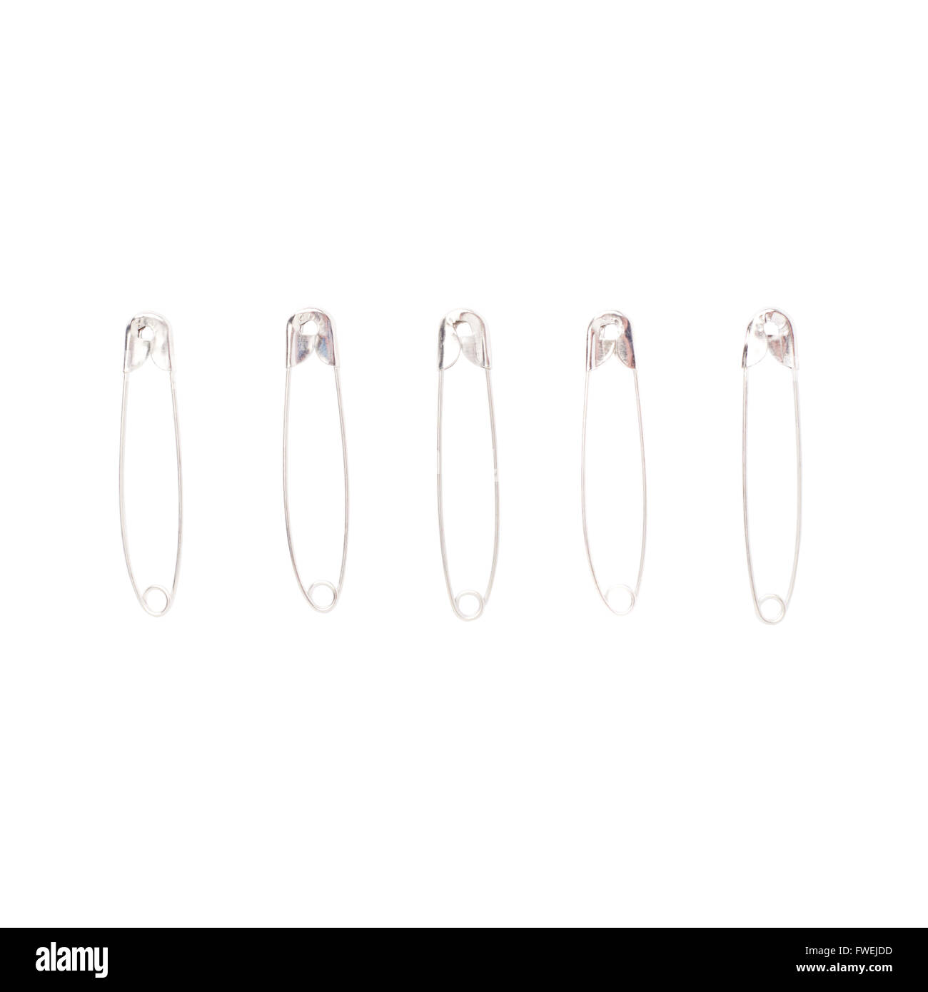 Safety pin isolated on white background Stock Photo - Alamy