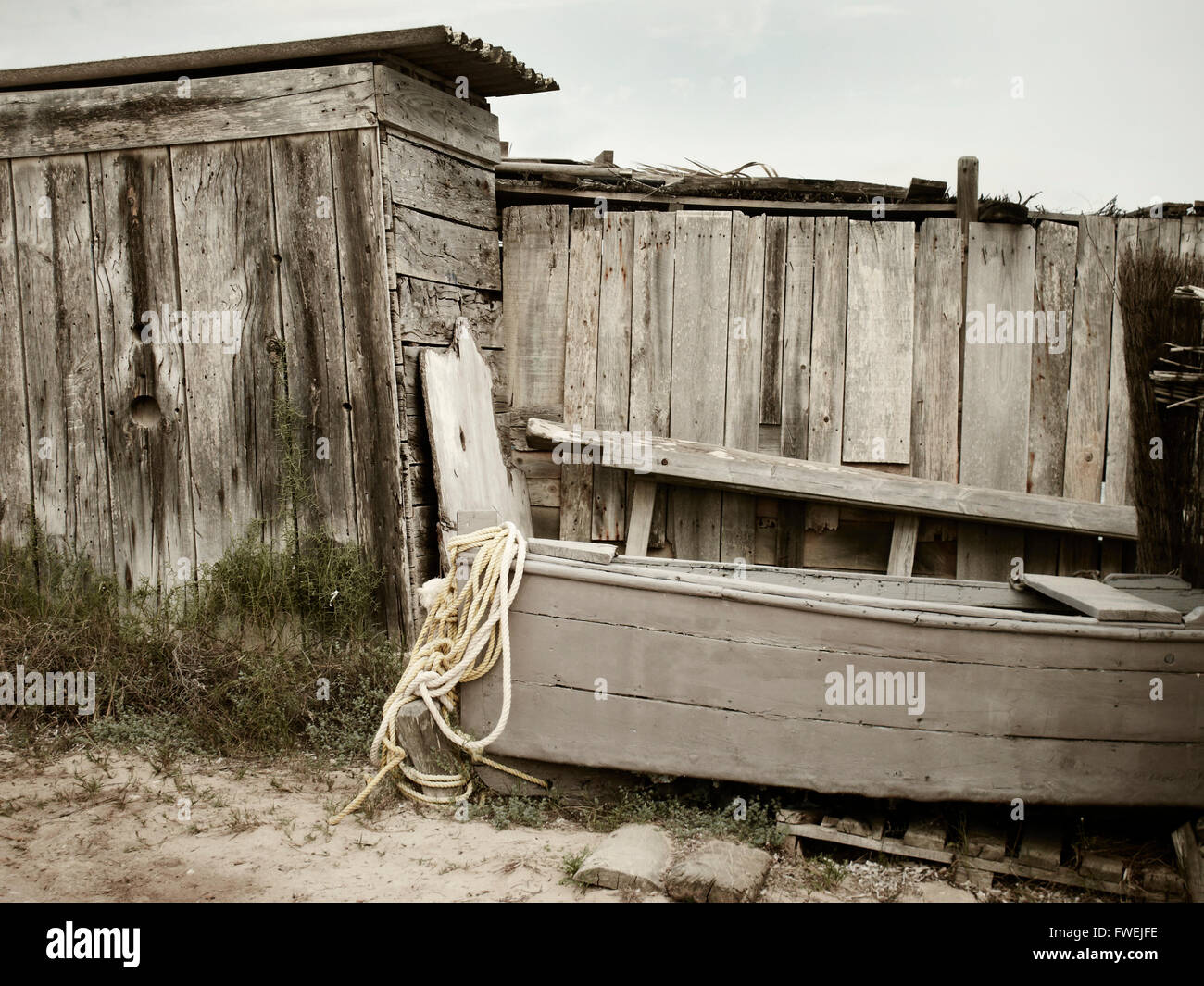 Old wooden beach warehouse and boat. Horizontal format Stock Photo - Alamy
