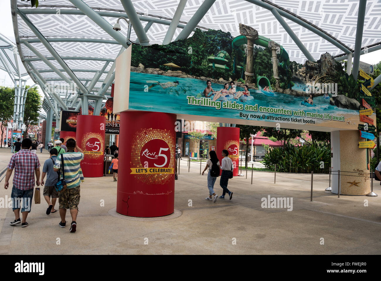 Visitors walk through the main thoroughfare at Sentosa fun park in ...