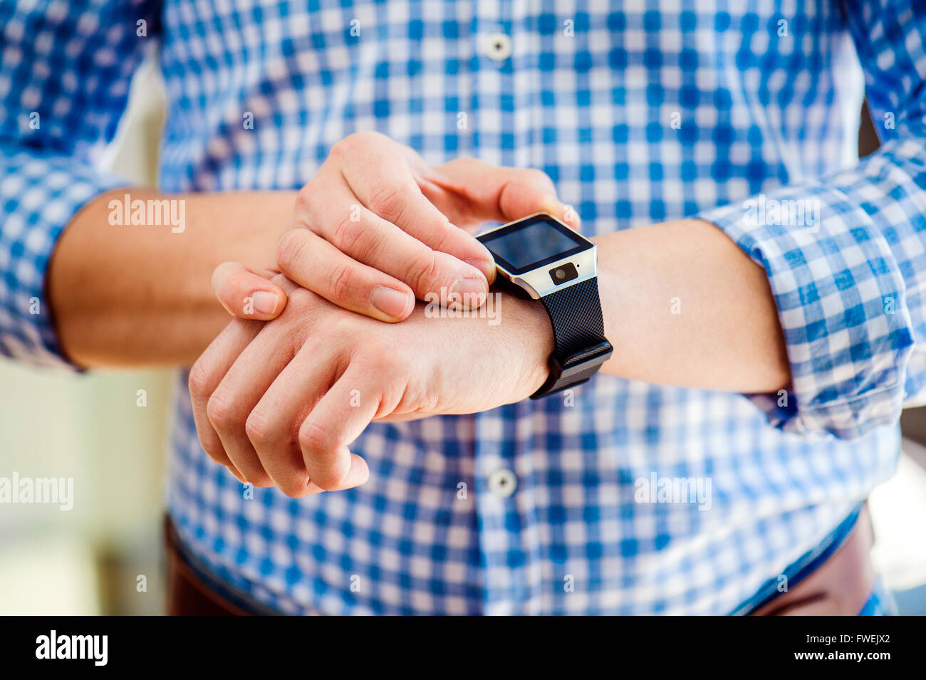 Close up of unrecognizable man using smart watch Stock Photo - Alamy