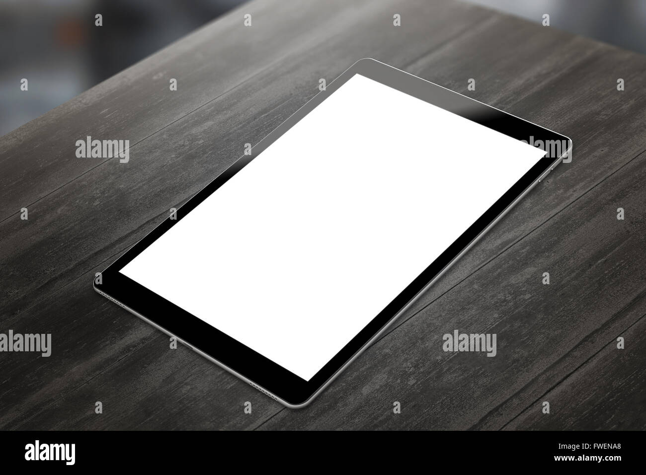 Tablet on wooden table with isolated white screen for mockup. Vertical ...