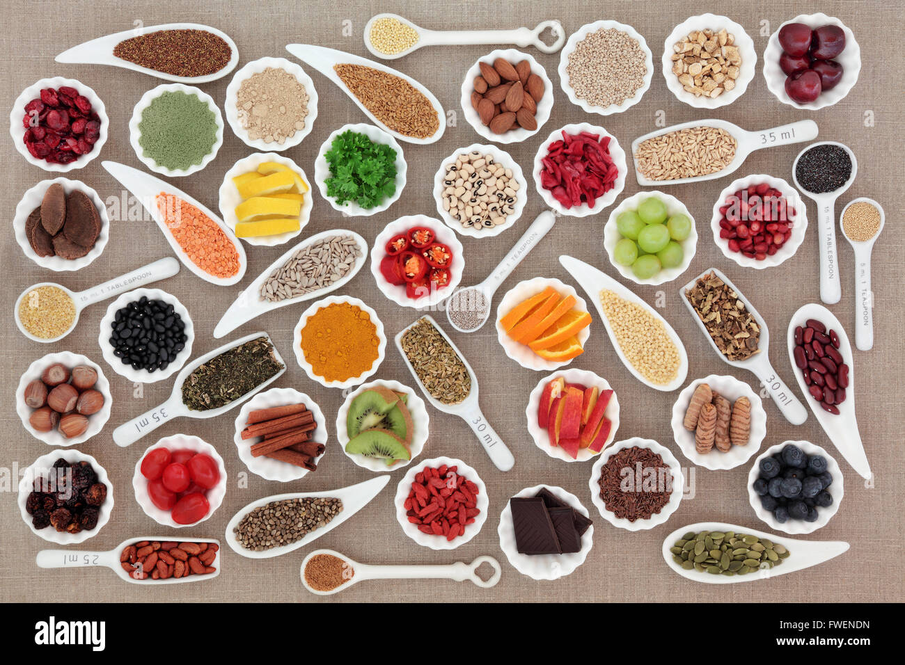 Large super food collection in porcelain bowls, spoons and scoops over ...