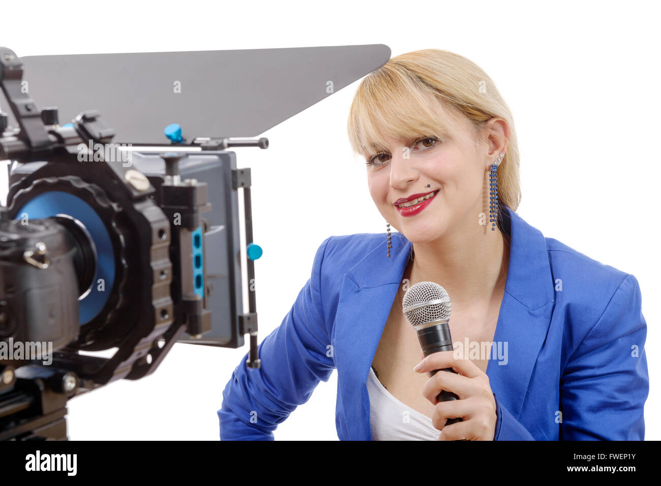 a portrait of elegant blonde woman TV reporter, who is smiling and ...