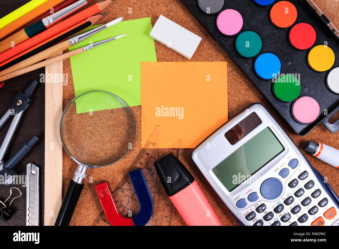 Office table desk with set of tools for creative art work on a white ...