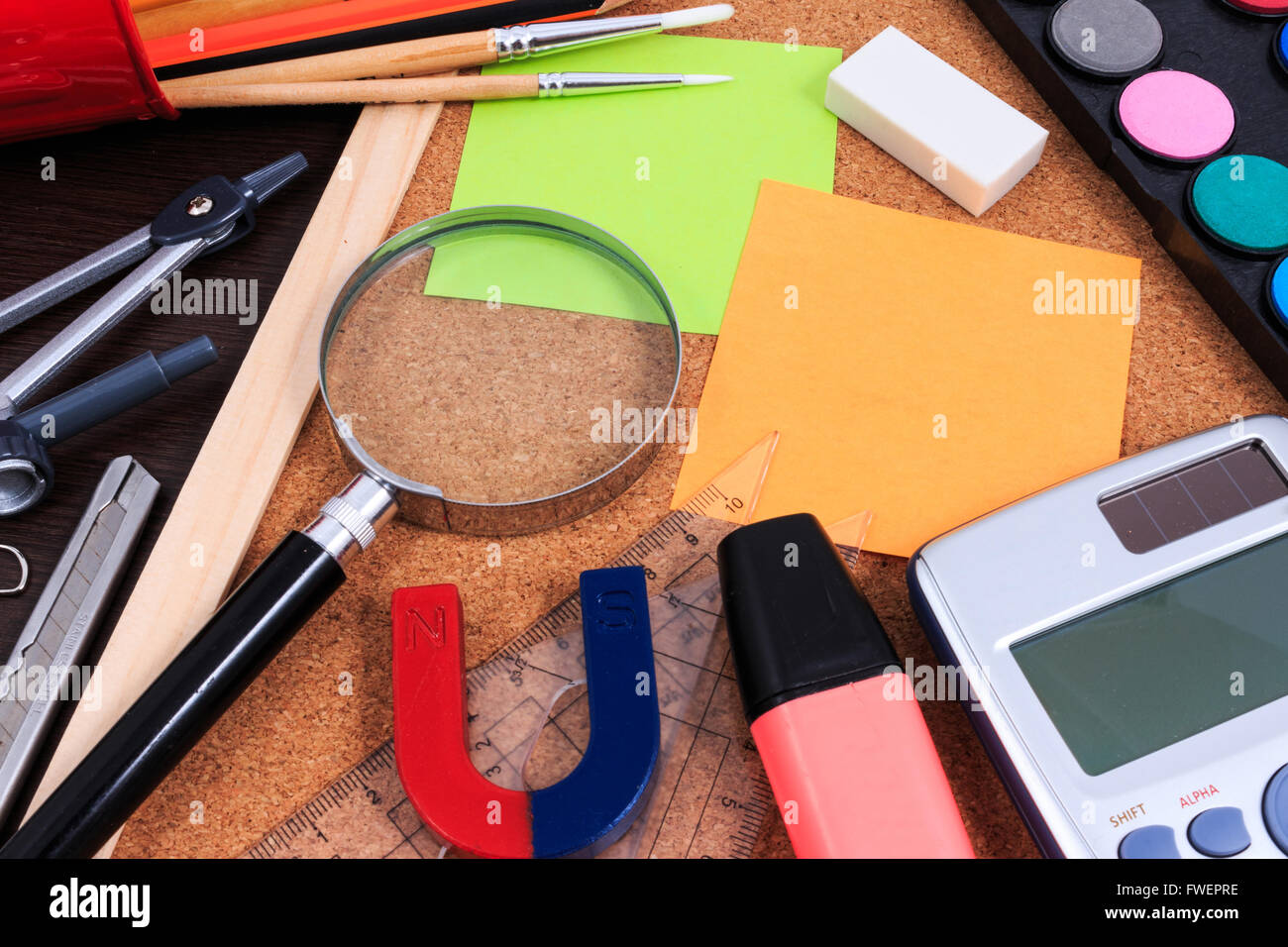 Office table desk with set of tools for creative art work on a white ...