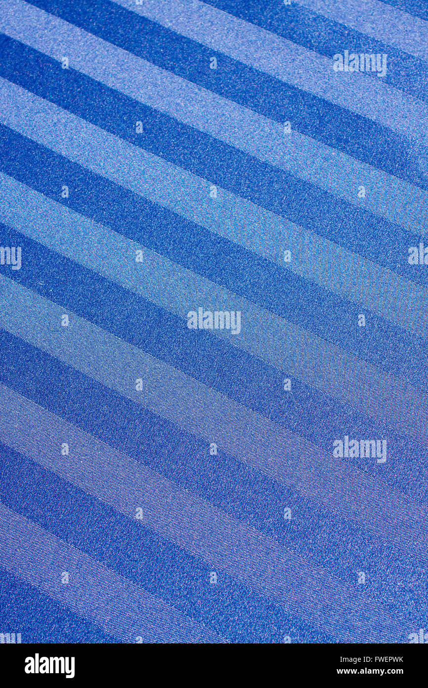 A blue striped background with the stripes going across this vertical ...