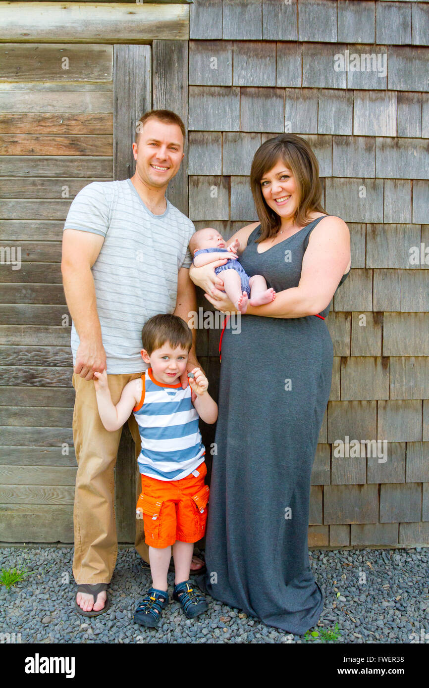 This family of four includes a mom, dad, 5 year old son, and a newborn ...